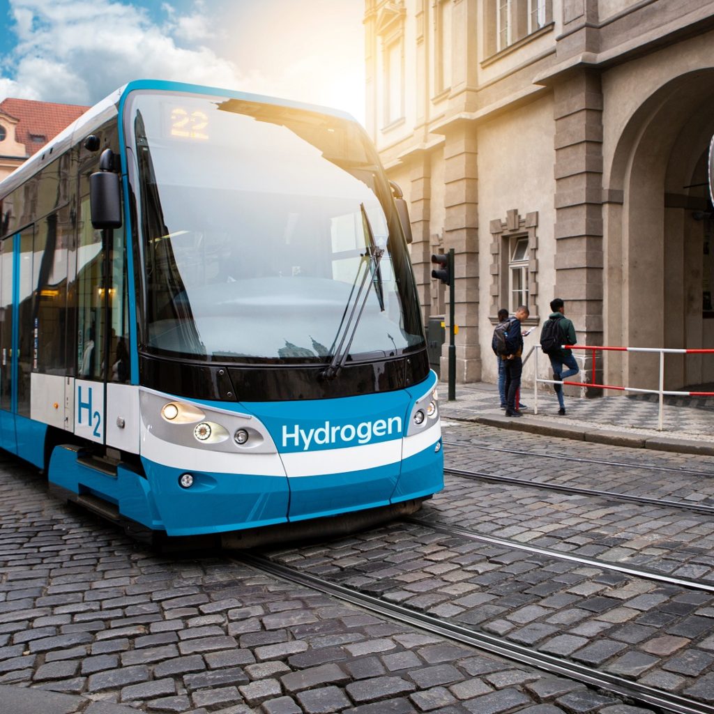 A hydrogen fuel cell tram on a city street - FBK